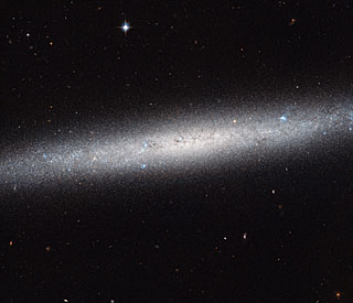 A galaxy on the edge | ESA/Hubble
