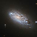 The peculiar asymmetry of NGC 949 | ESA/Hubble
